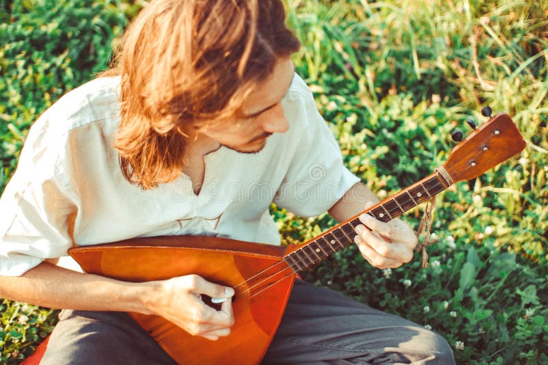 Man playing the balalaika stock photo. Image of melody - 143327610