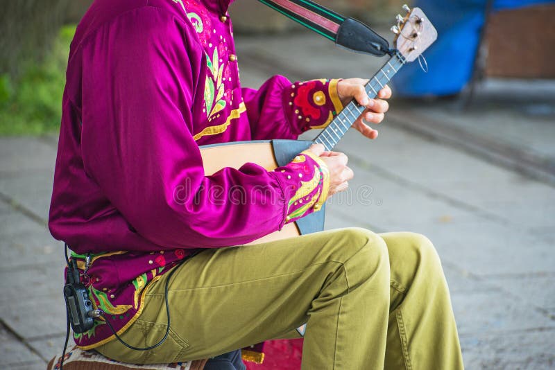 Man playing the balalaika stock image. Image of traditional - 7589595