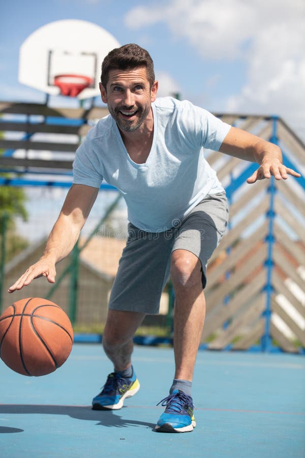 Man Playing Basketball in Front Basket Stock Image - Image of energy ...