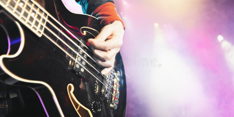Man Playing Bass Guitar at Concert Stock Photo - Image of metal, male ...
