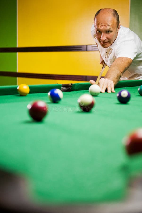 Young man playing pool. stock photo. Image of leisure - 2037224