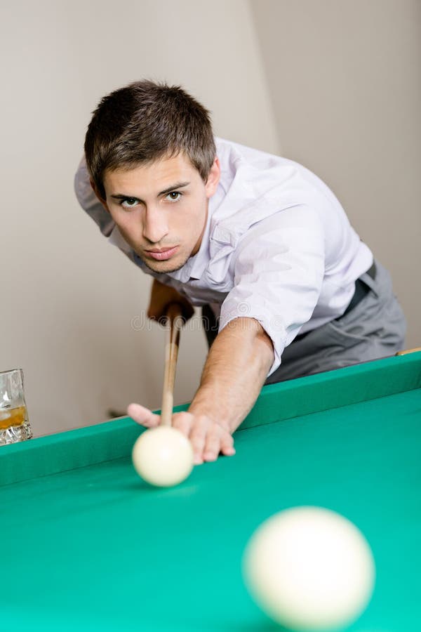 Young man playing pool. stock photo. Image of leisure - 2037224
