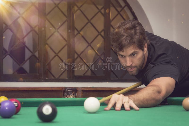 Man Playing Billiards in a Pool Table. Stock Image - Image of green ...