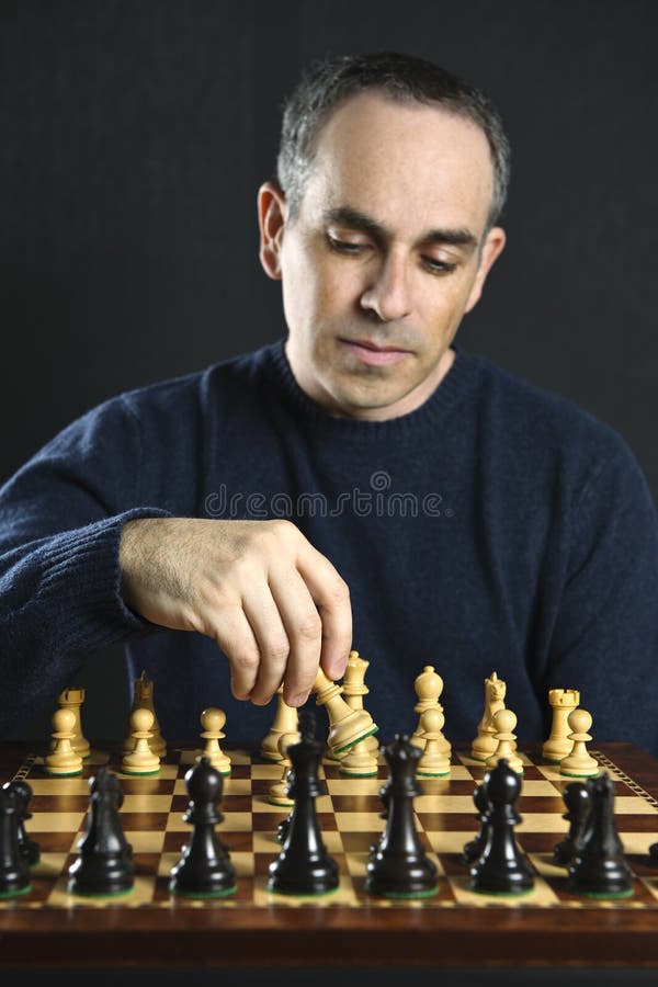 Man playing chess stock image. Image of chessboard, hand - 13875979