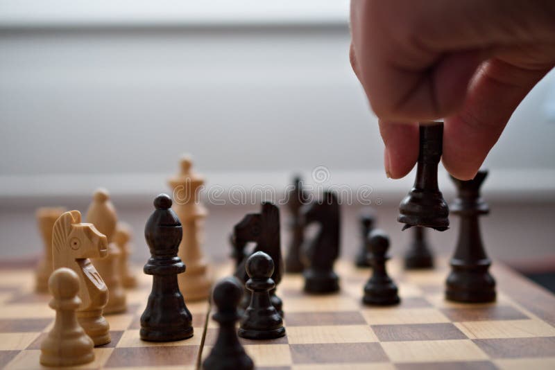 Man Playing Chess, Moving a Black Tower Stock Photo - Image of ...
