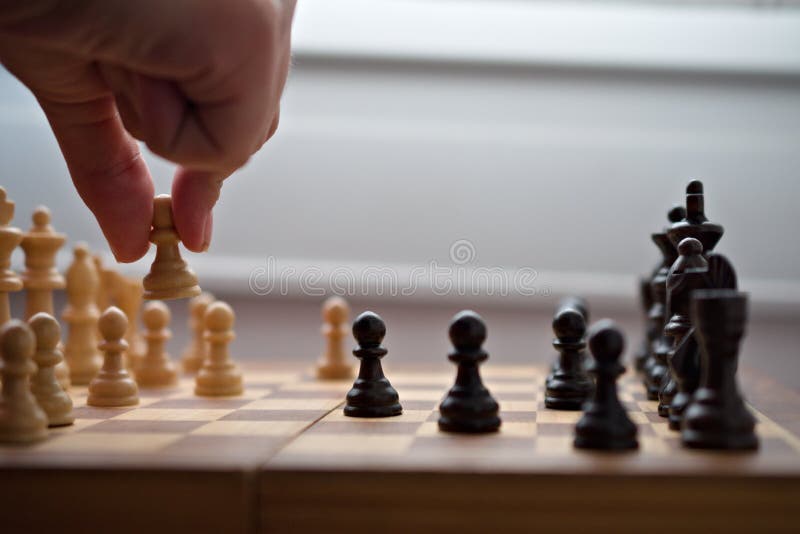 Man Playing Chess, Moving a White Pawn Stock Photo - Image of ...