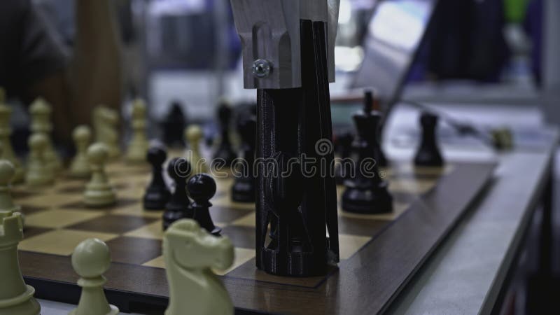 Man is Playing Chess with Robot. Media. Man is Playing Chess Against ...