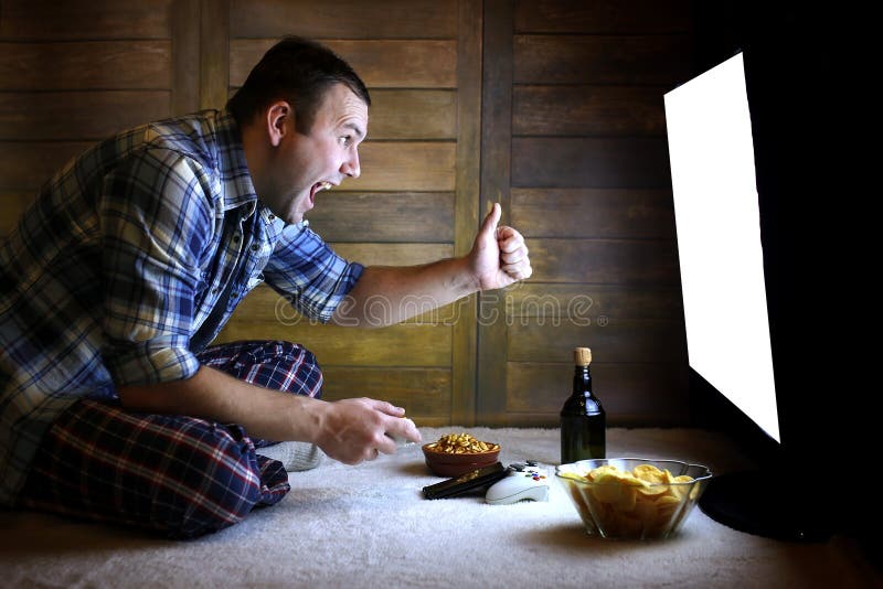 Man Playing on a Console on the Joystick before the Big TV Stock Photo ...