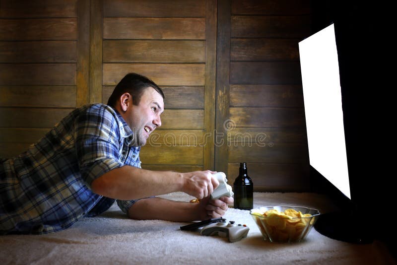 Man Playing on a Console on the Joystick before the Big TV Stock Photo ...
