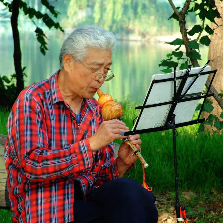 Man Playing the Cucurbit Flute Editorial Image - Image of silver ...