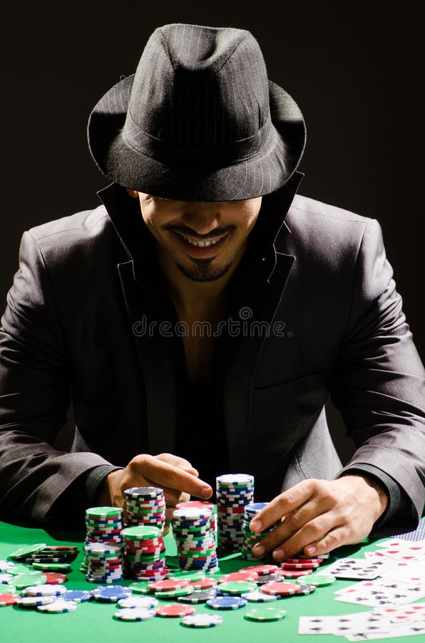 Man playing in dark casino stock photo. Image of game - 57711096
