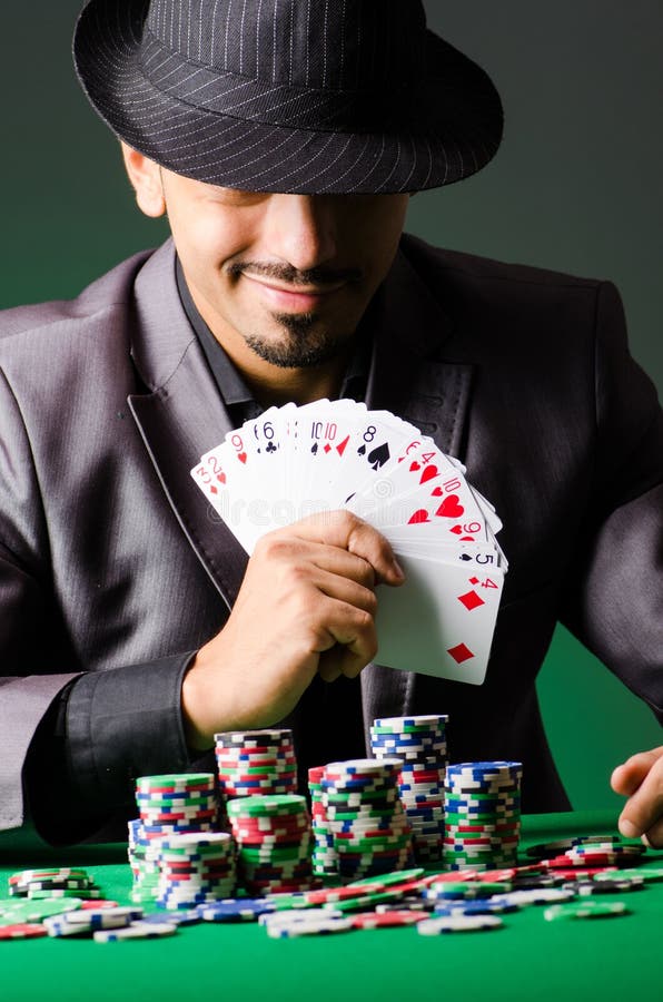 Man playing in dark casino stock image. Image of card - 59019881
