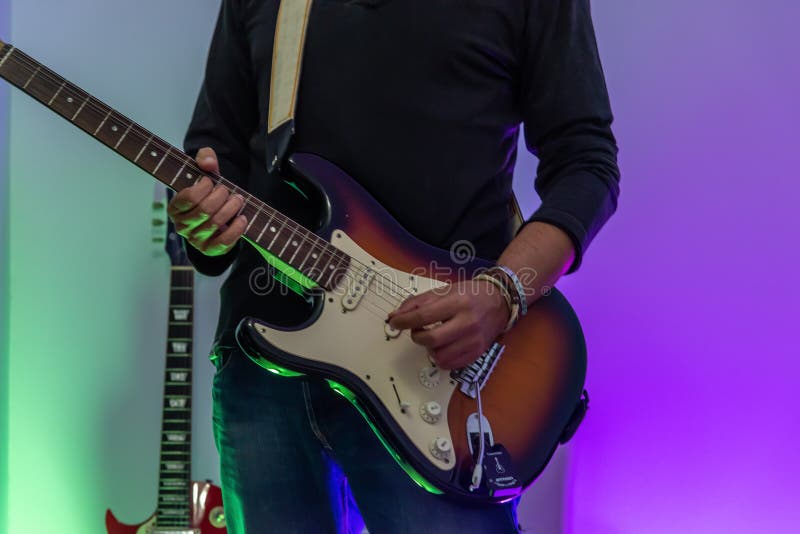 Man Playing an Electric Guitar at Home Stock Photo - Image of musical ...