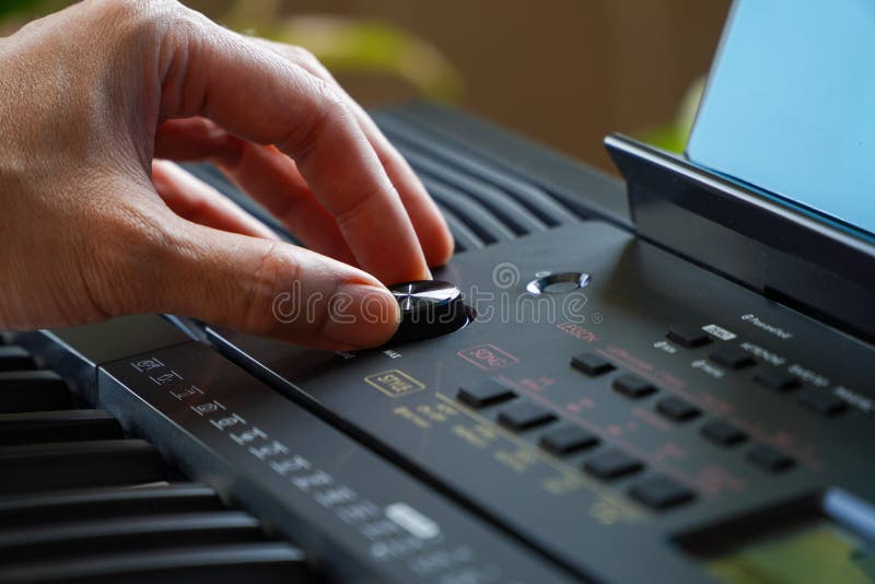 Man Playing Electronic Music Keyboard Synthesizer with Hands Adding ...