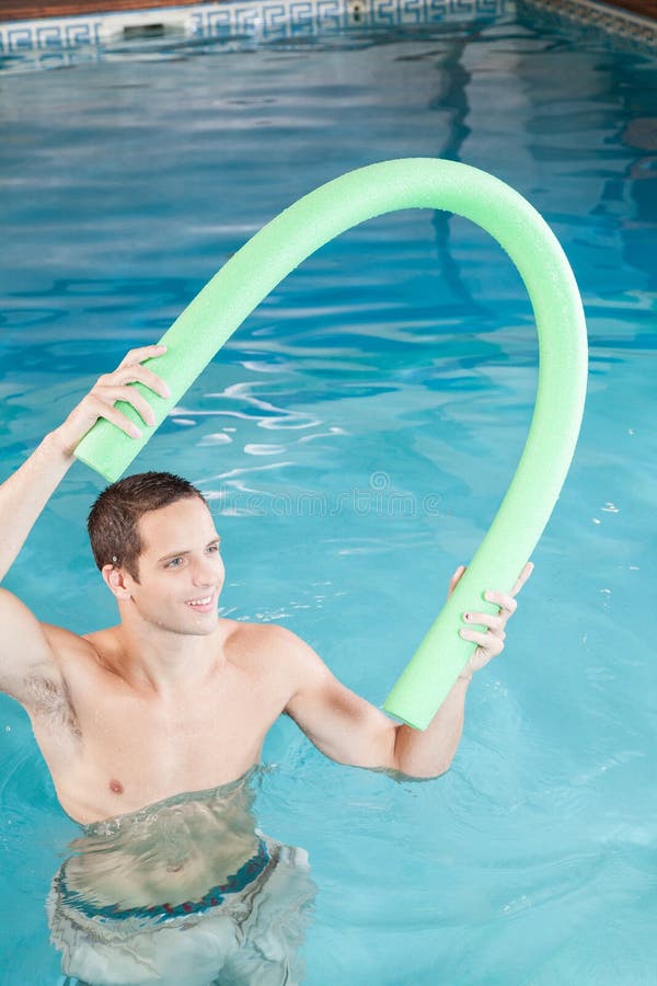 Man playing with float stock image. Image of face, pool - 65088699