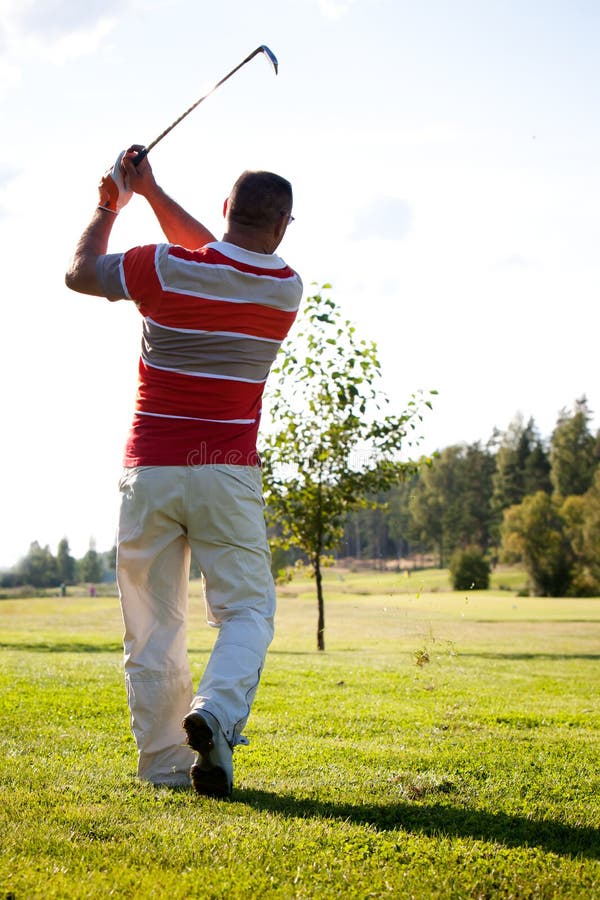 Man playing golf stock image. Image of recreation, adult - 26160323