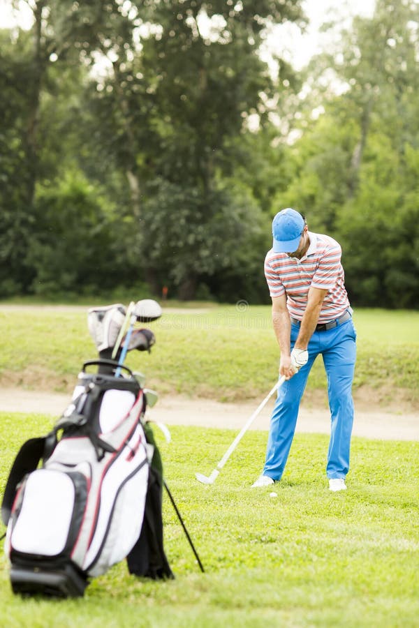 Man playing golf stock photo. Image of grass, sport, active - 74249558