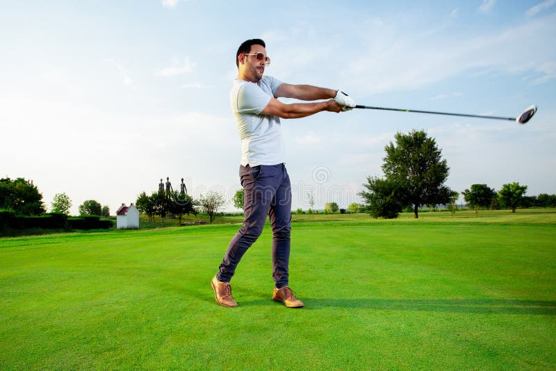 Man Playing Golf on a Golf Course in the Sun Stock Photo - Image of ...