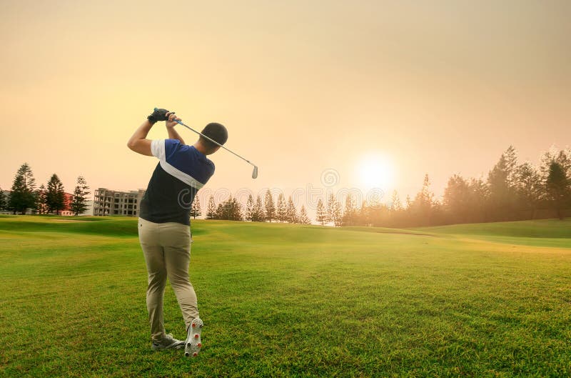Man Playing Golf on a Golf Course in the Sunrise. View from the Back ...