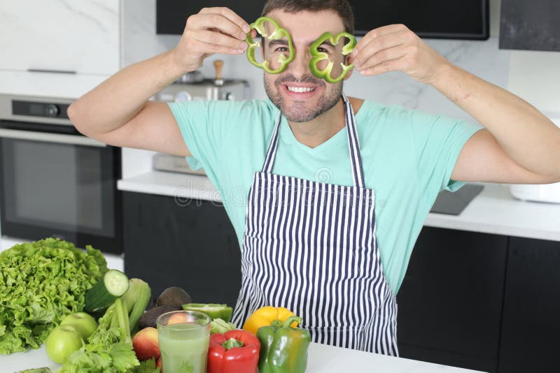Man Playing with Green Bell Peppers in the Kitchen Stock Image - Image ...