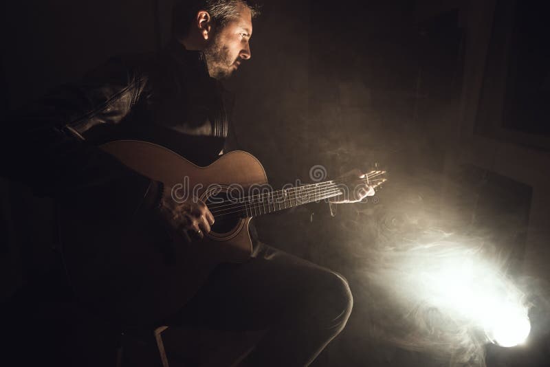 Guy Handsome Playing Guitar. Musician Playing Acoustic Guitar at Home ...