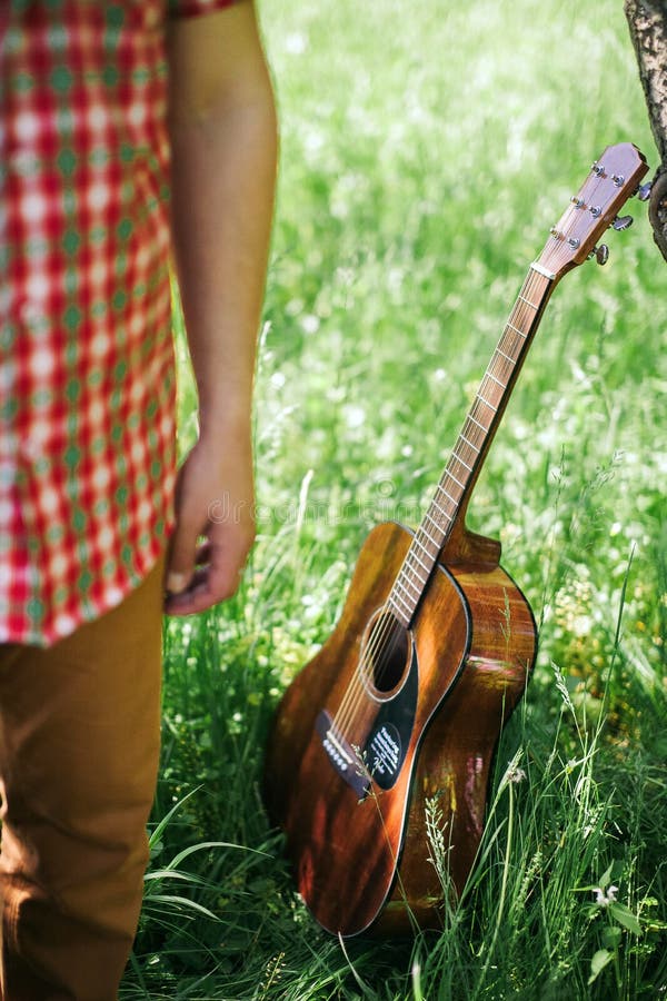 Man Playing Guitar on Picnic Stock Image - Image of couple, girl: 84336881