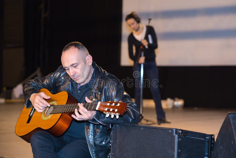 Man Playing Guitar on Stage Stock Photo - Image of metal, finger: 101439718