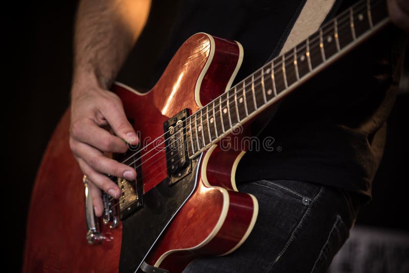A Rocker is Playing Guitar on Stage. Stock Photo - Image of accord ...