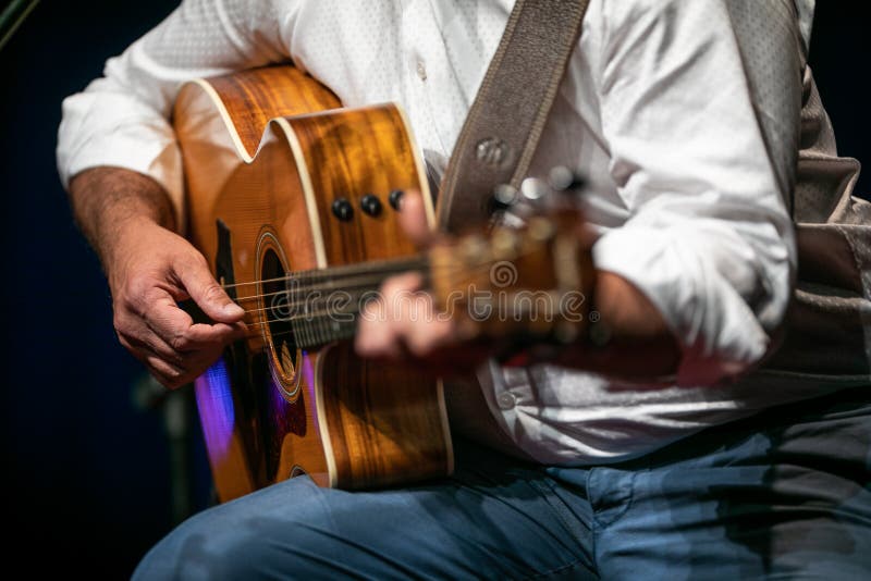 Man Playing a Guitar on Stage Stock Image - Image of fretboard ...