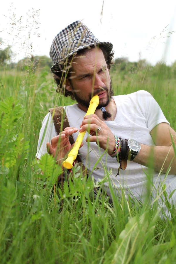 Man playing flute stock image. Image of agricultural - 32318593