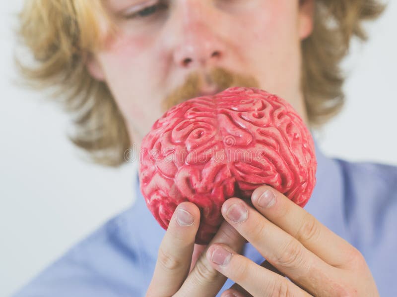 Man Playing with Human Brain Stock Photo - Image of knowledge ...