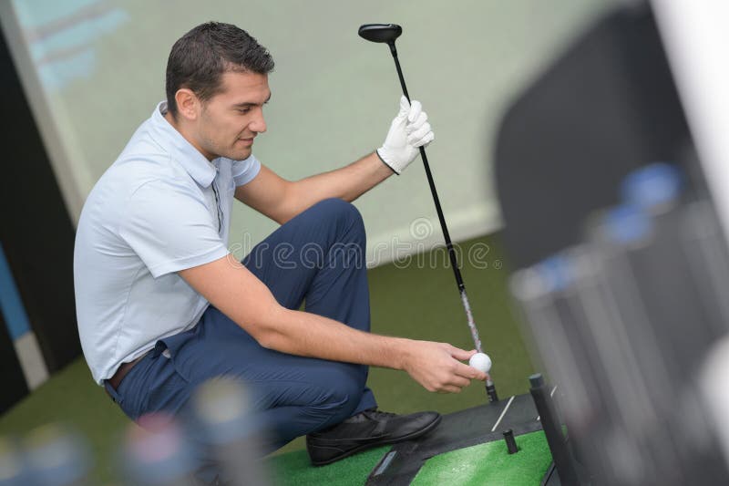 Man playing indoor golf stock photo. Image of indoor - 314280448