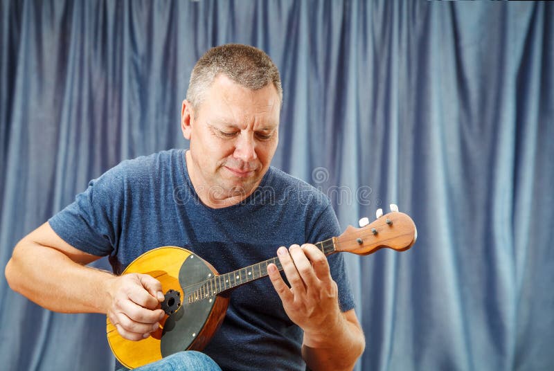 Man playing the mandolin stock image. Image of musicians - 128576859