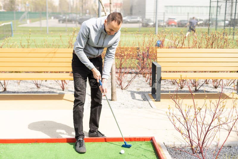 Man Playing Mini Golf. Summer Season Game Stock Image - Image of game ...
