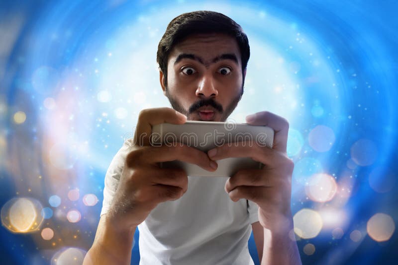 Man Playing Mobile Games on Bokeh Background Stock Image - Image of ...