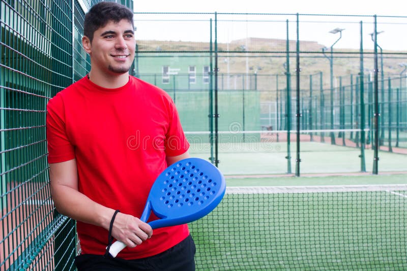 Man playing paddle tennis stock photo. Image of ball - 51793660