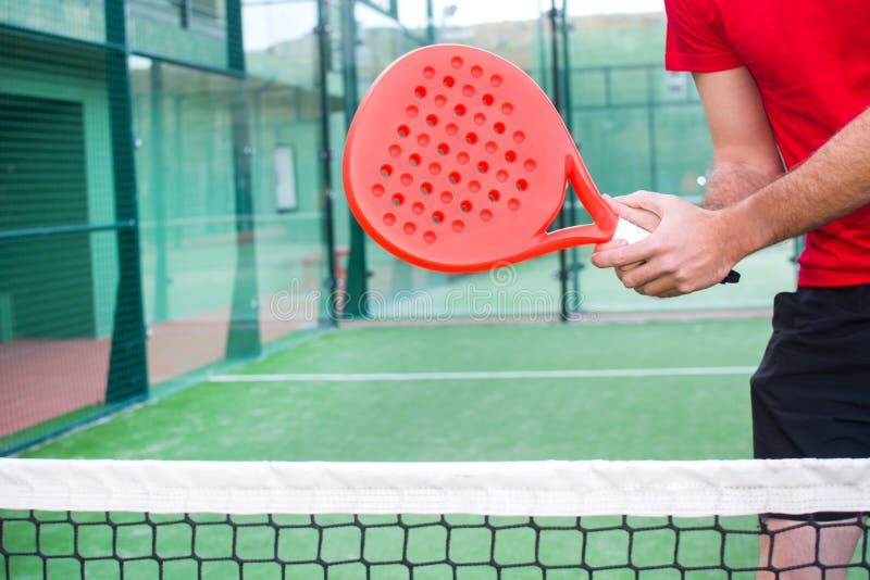 Man playing paddle tennis. stock photo. Image of paddle - 51875866