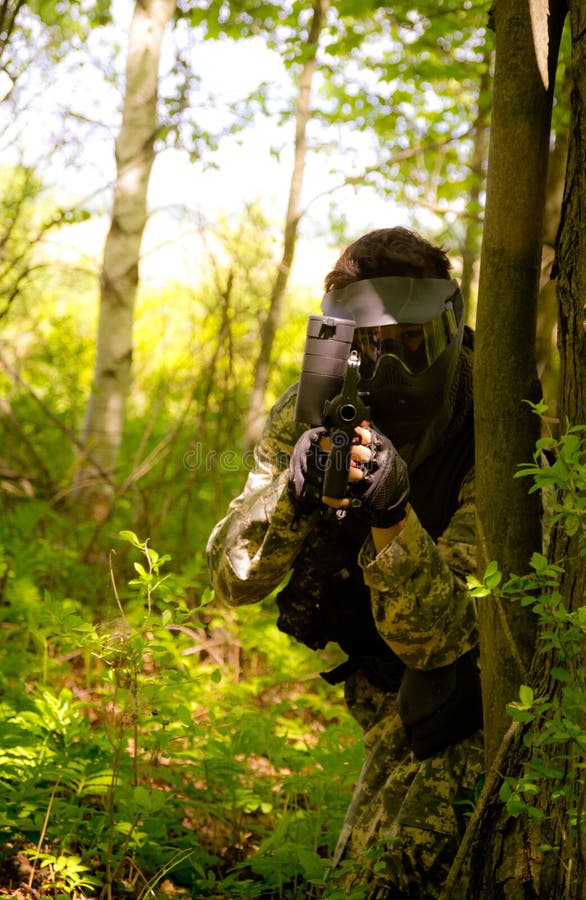 Man playing paintball stock image. Image of equipment - 31670643