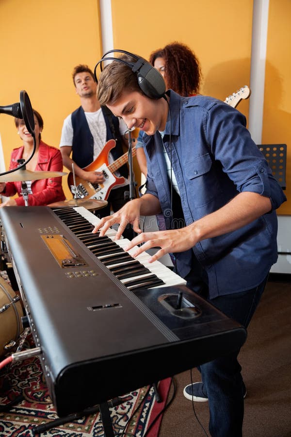 Man Playing Piano while Band Performing in Stock Photo - Image of ...