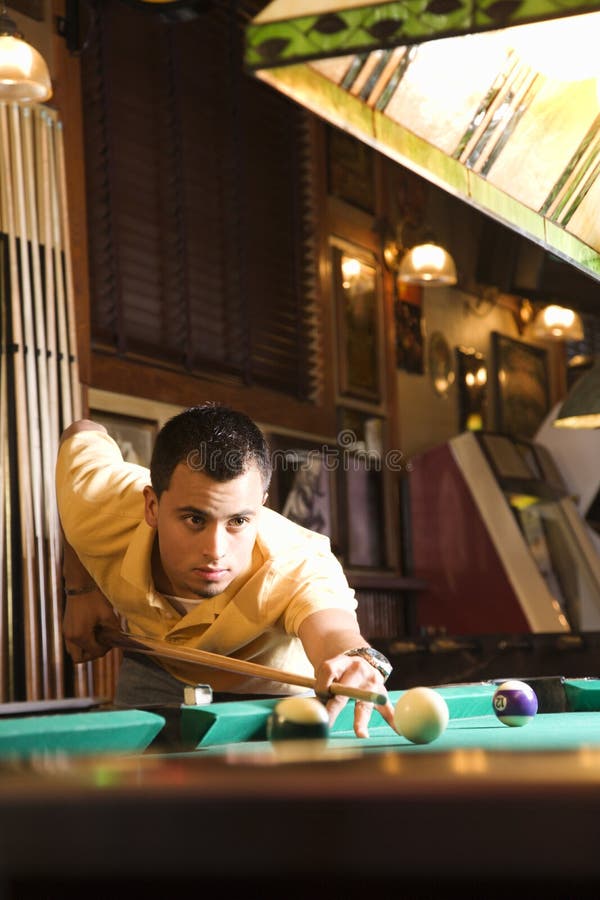 Young man playing pool. stock photo. Image of leisure - 2037224