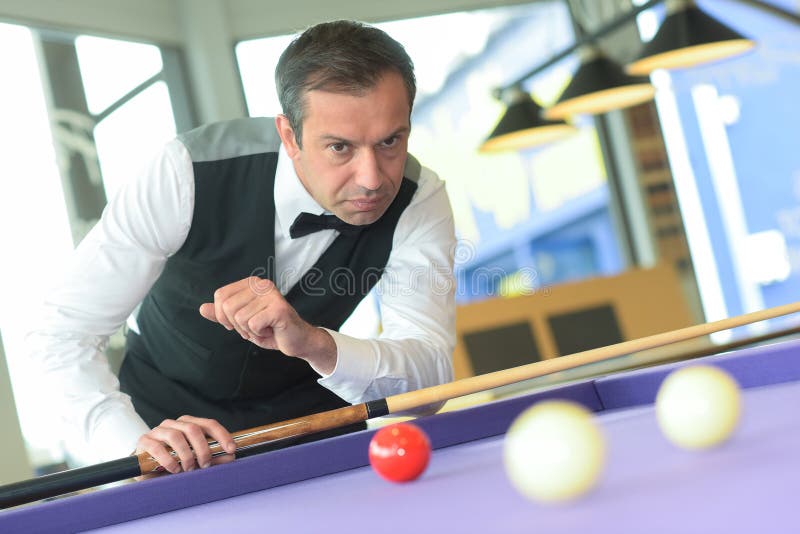 Man playing pool in bar stock image. Image of billiard - 99328189