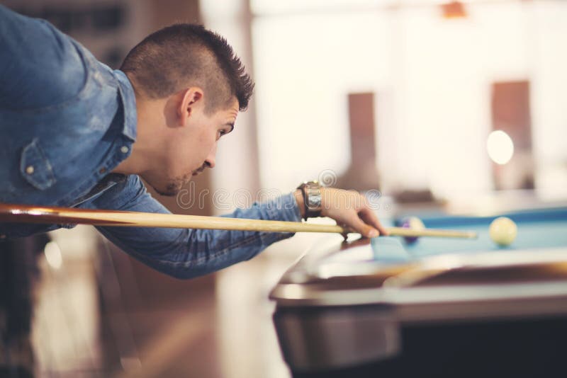 Man playing pool in pub stock photo. Image of billiard - 82879134