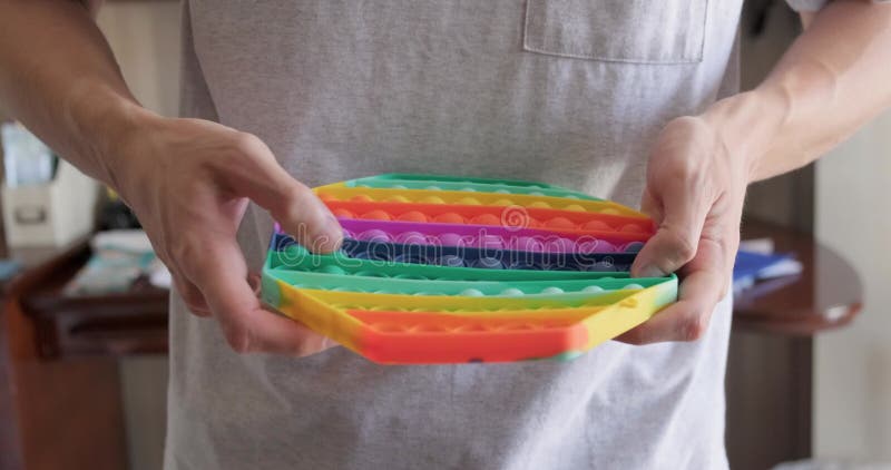 Man playing popit toy. stock video. Video of relax, game - 228906661