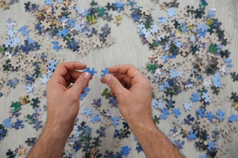Man Playing with Puzzles on Floor, Top View Stock Image - Image of ...