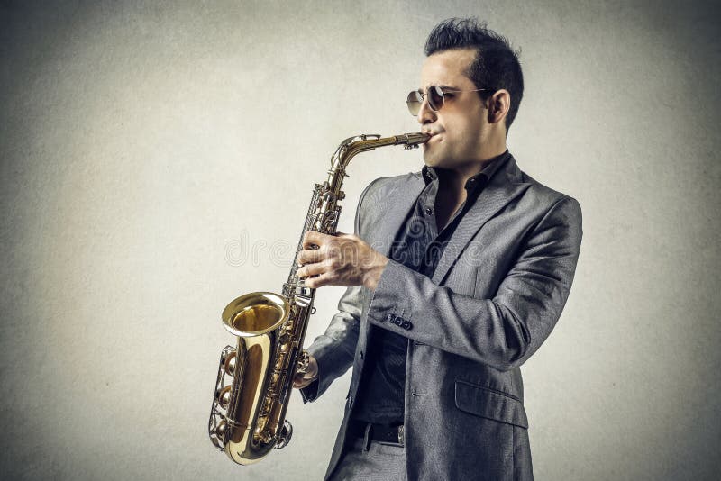 Man playing the sax stock image. Image of handsome, instrument - 37254801