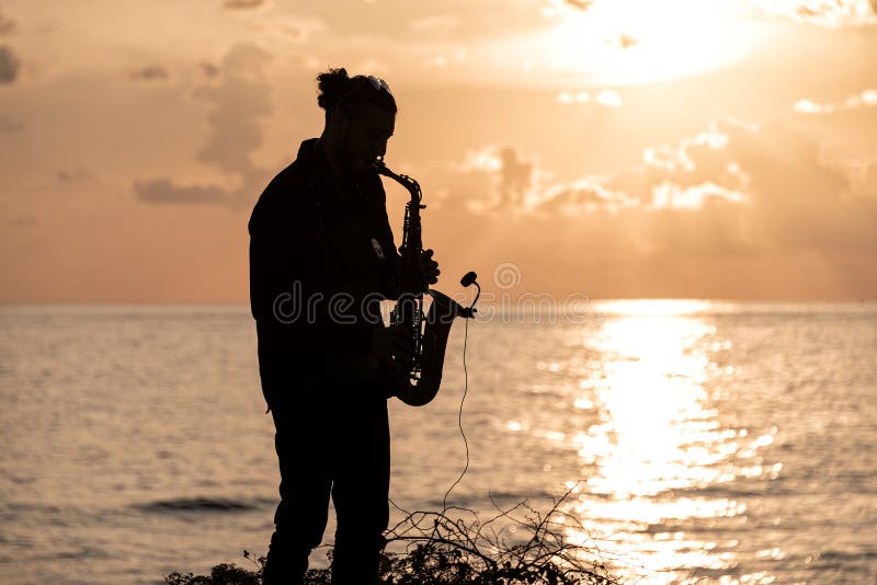 Man Playing Saxophone Outdoors Sunset Stock Photos - Free & Royalty ...