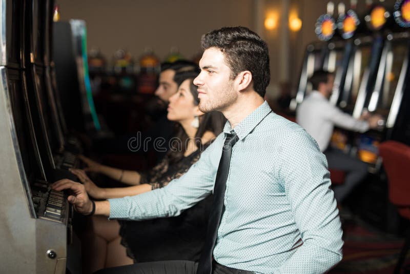 Man Playing in a Slot Machine Stock Image - Image of people, nightclub ...