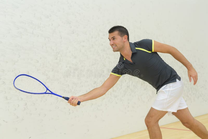 Man playing squash stock image. Image of equipment, detail - 197918033