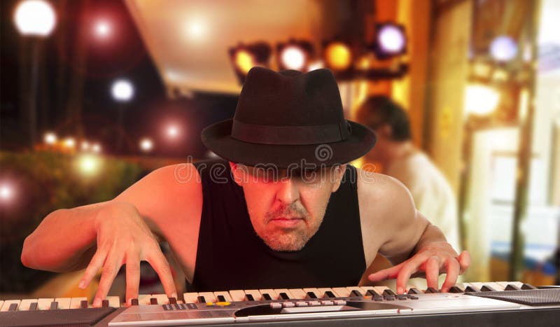 Man playing synthesizer stock image. Image of keyboard - 65000975