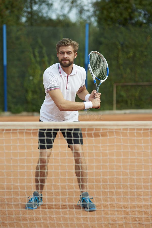 Man playing tennis stock photo. Image of holding, returning - 78720762